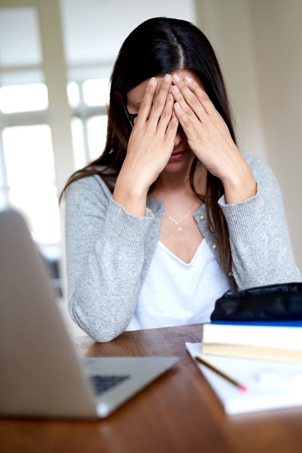 Woman Sitting at Work Desk with Head in Hands. Stock Image - Image of ...