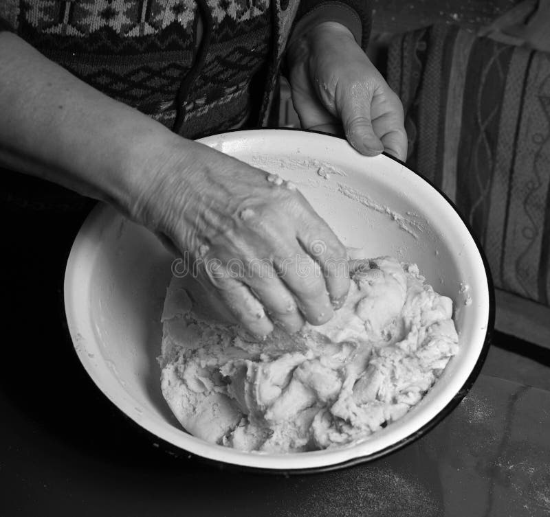 Woman Skillfully Kneading Dough Using Hands, Focusing on the Texture ...