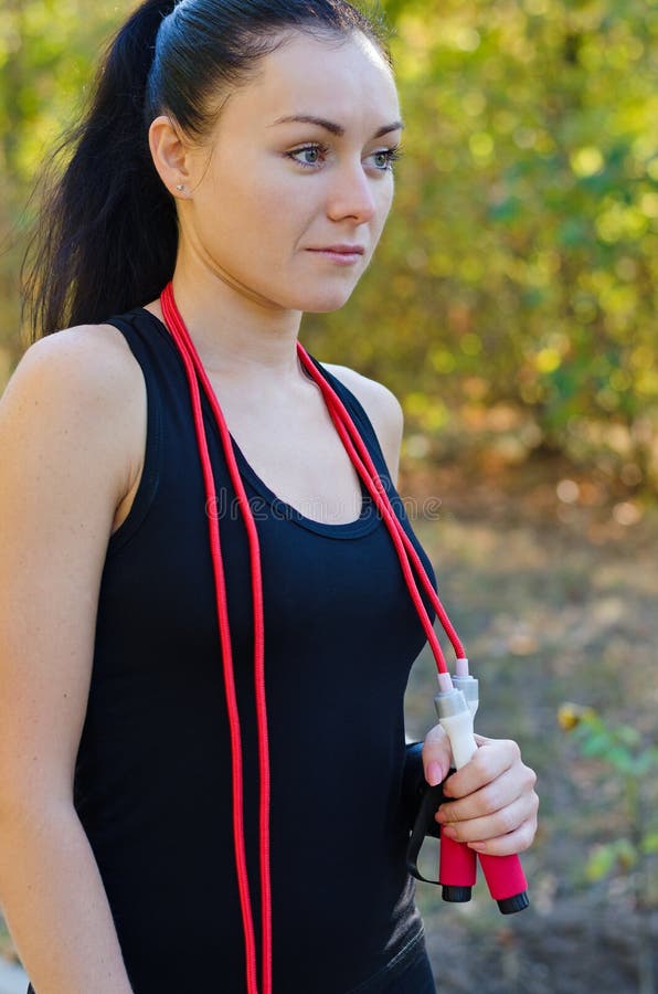 Woman with Skipping Rope Around Her Neck Stock Photo - Image of sport ...