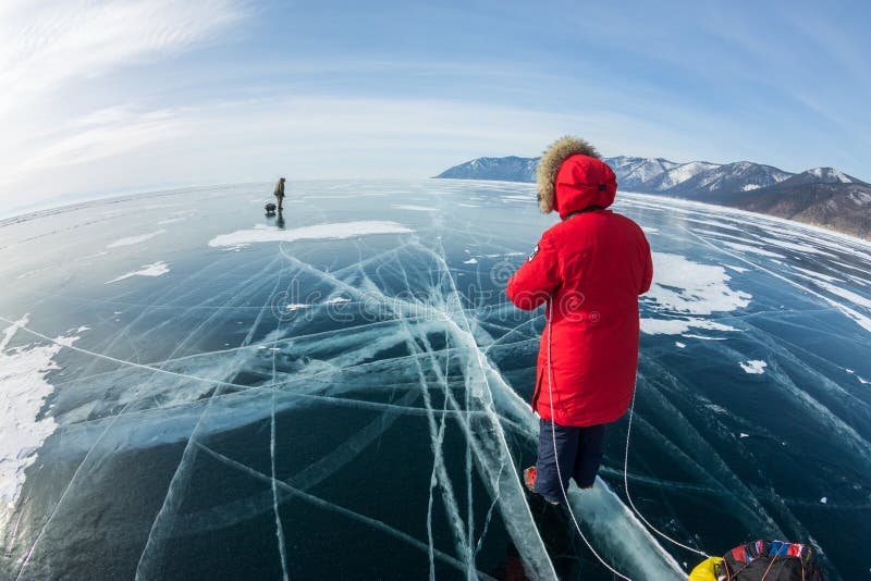 Woman with a Sledge Walk is on the Ice of Lake Baikal Stock Photo ...
