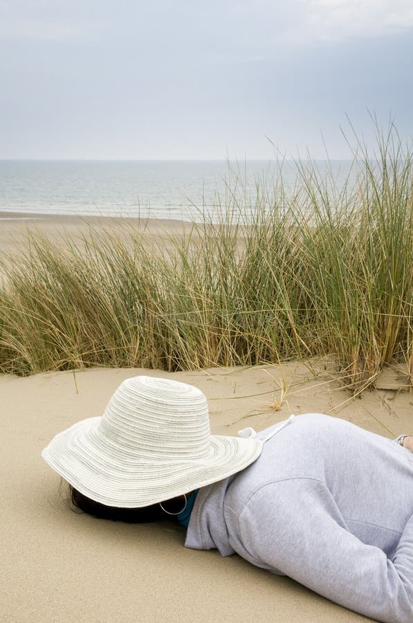 Woman sleeping on beach stock image. Image of sand, coast - 24687469