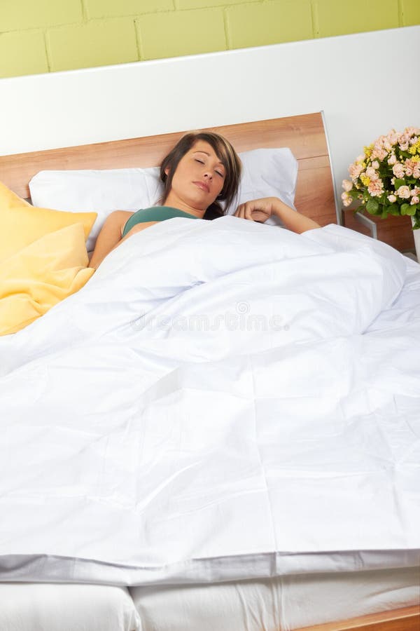 Woman Sleeping in Bed stock photo. Image of solitary - 15722246