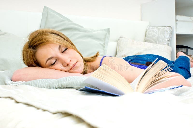 Woman sleeping over book stock photo. Image of confortable - 29115828