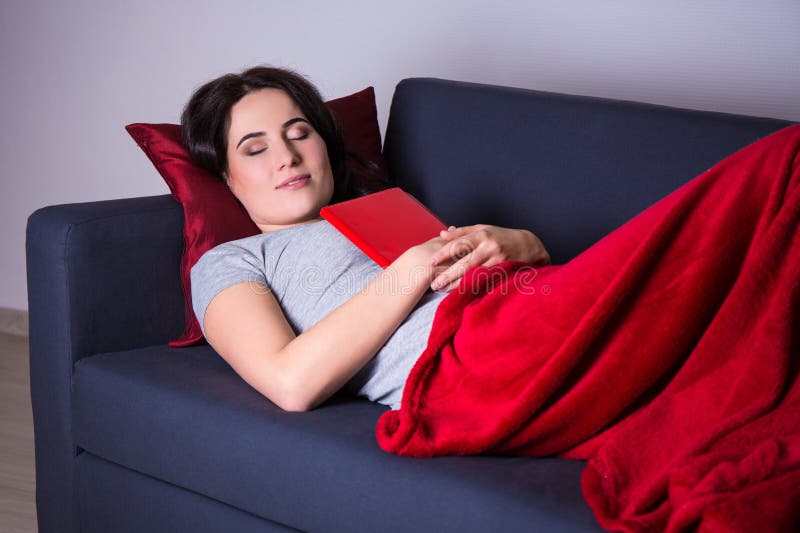 Woman Sleeping with Book on Sofa at Home Stock Photo - Image of couch ...