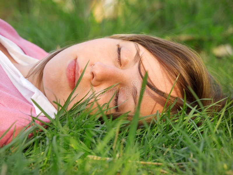 Woman Sleeping on the Grass Stock Photo - Image of beautiful, surface ...