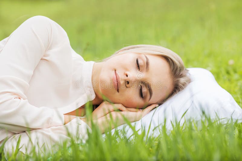 Woman Sleeping on Pillow in Grass Stock Photo - Image of woman, sleep ...
