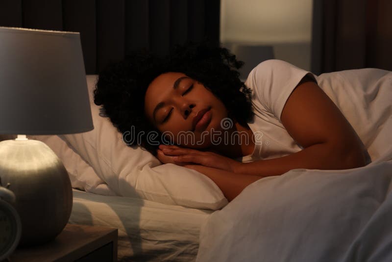 Young Woman Sleeping in Soft Bed at Night Stock Photo - Image of ...