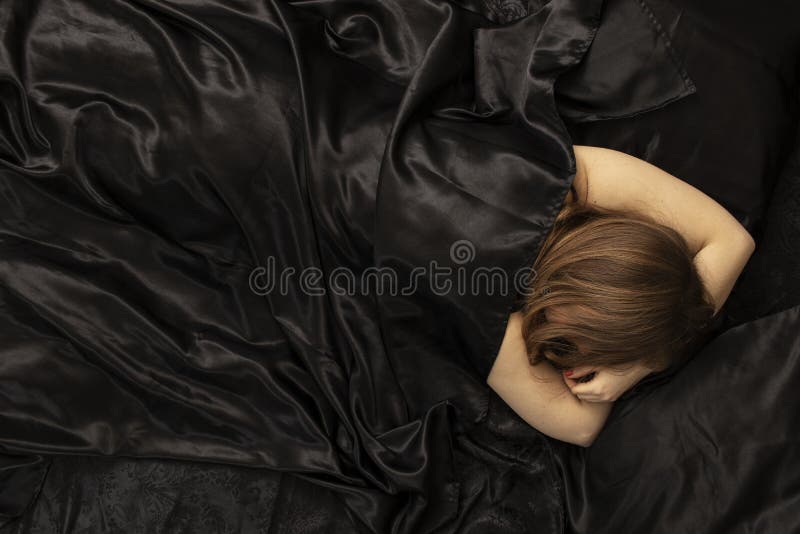 Woman Sleeps in a Bed on Black Bed Sheet. Stock Image - Image of ...