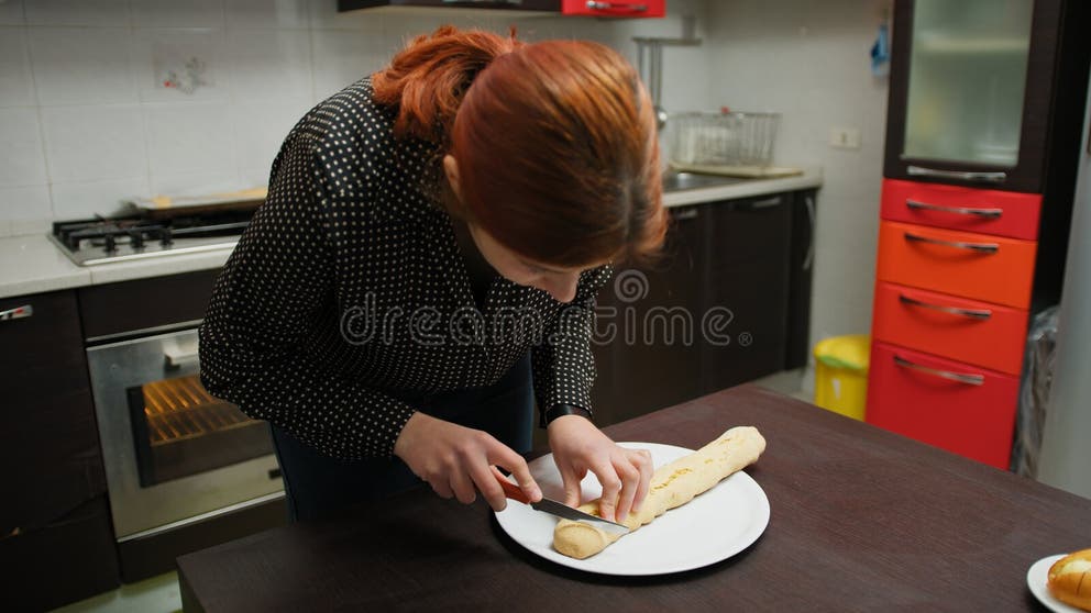 Woman Slices Cantucci Biscuits after First Baking in the Oven Stock ...