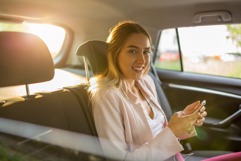 Woman with Smart Phone in a Car Stock Photo - Image of carsharing ...