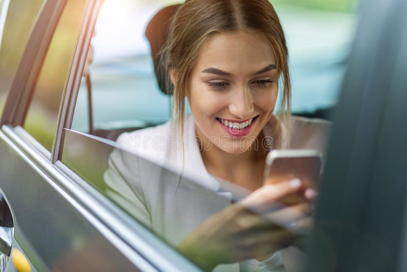 Woman with Smart Phone in a Car Stock Image - Image of adult, passenger ...