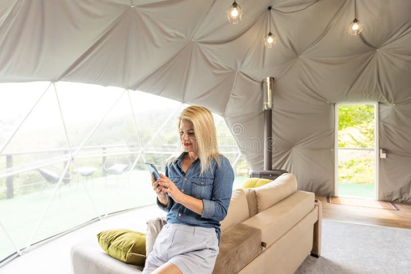 Woman with Smartphone in Dome Tent Stock Photo - Image of device ...