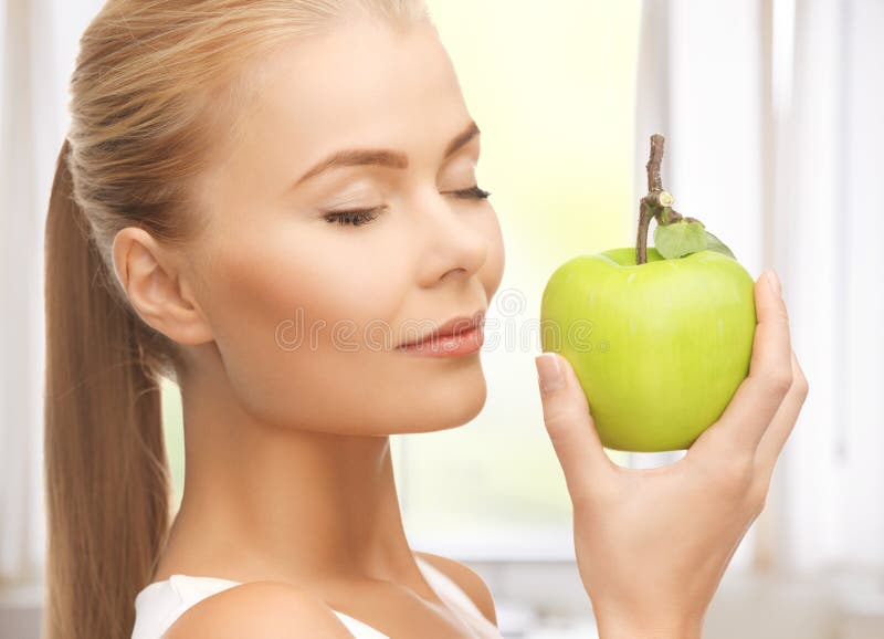 Woman smelling apple stock image. Image of beautiful - 38289965