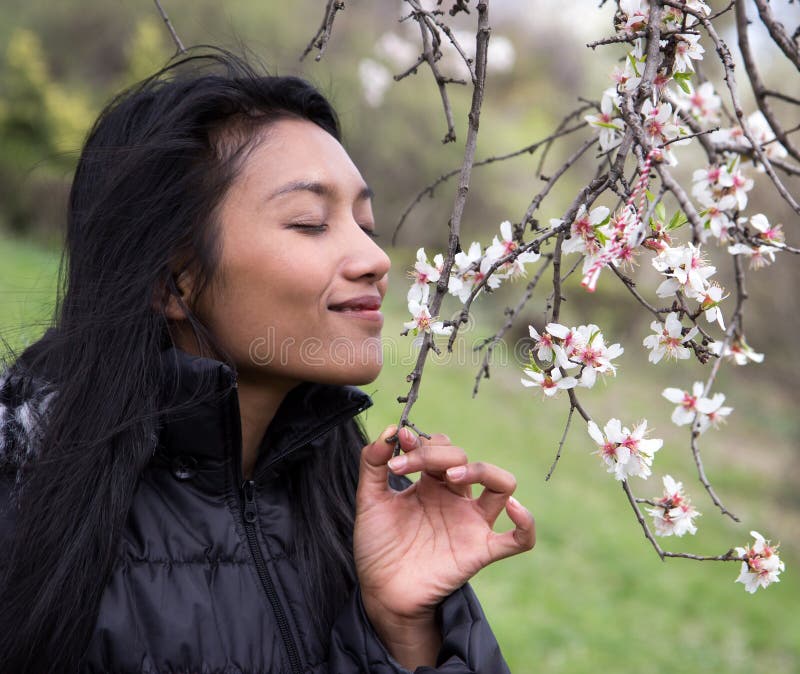 Woman Smelling a Flower Tree Stock Image - Image of garden, smell: 50300955