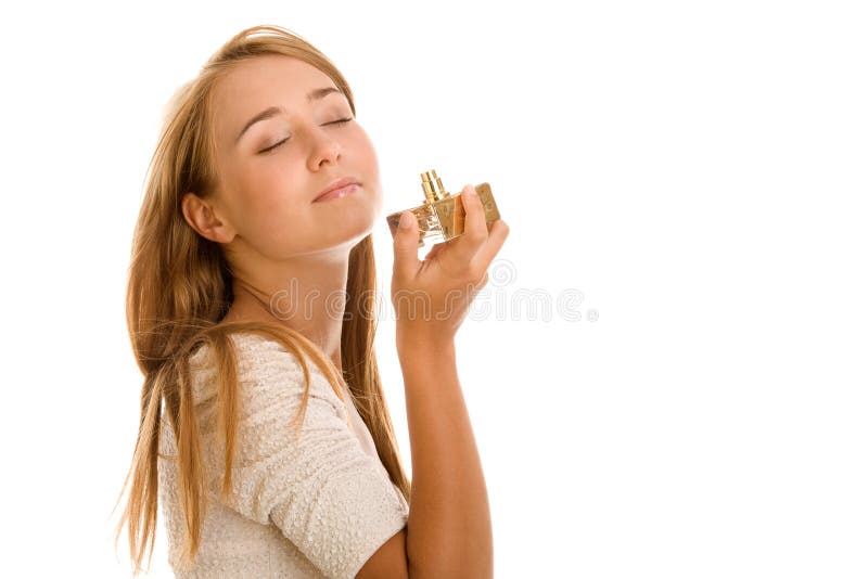 Woman smelling perfume stock photo. Image of cosmetic - 17023256