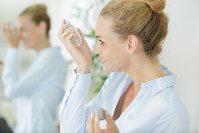 Woman smelling perfume stock photo. Image of fragrance - 291016946