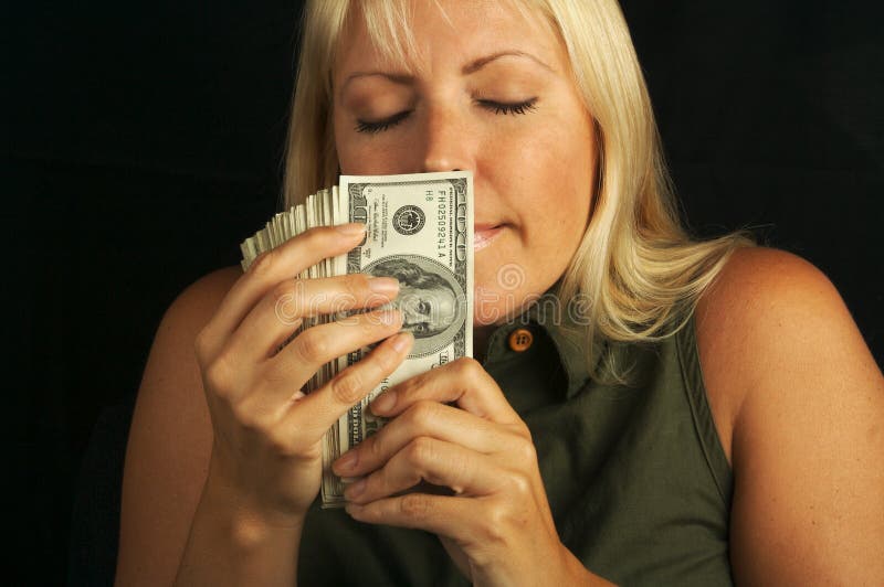 Woman Smelling Stack Of Money Picture. Image: 3025813
