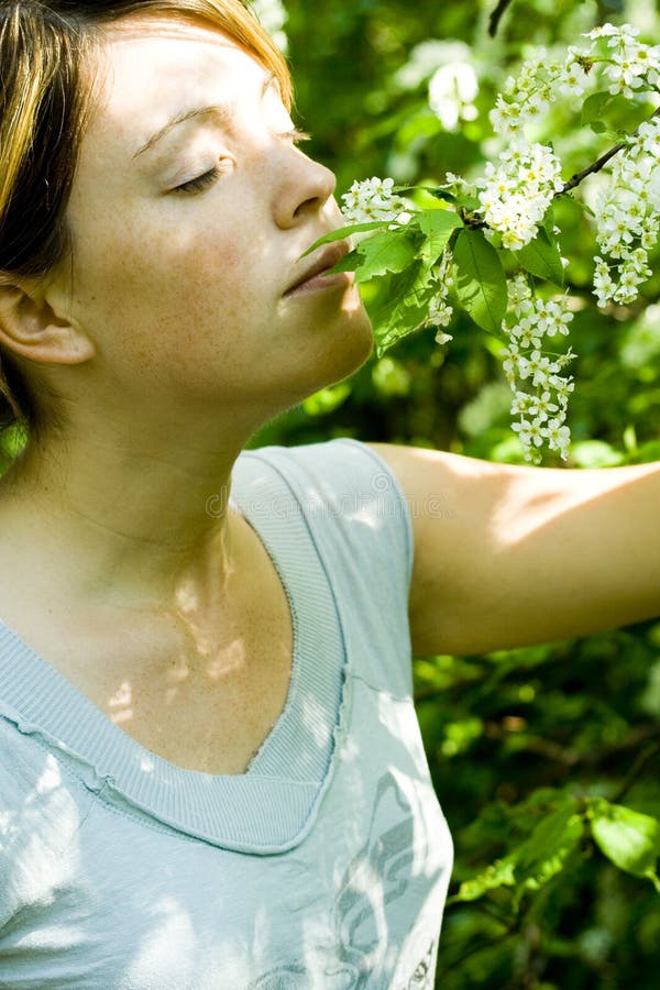 Woman Smells Flowering Tree Stock Photo - Image of foliage, beautiful ...