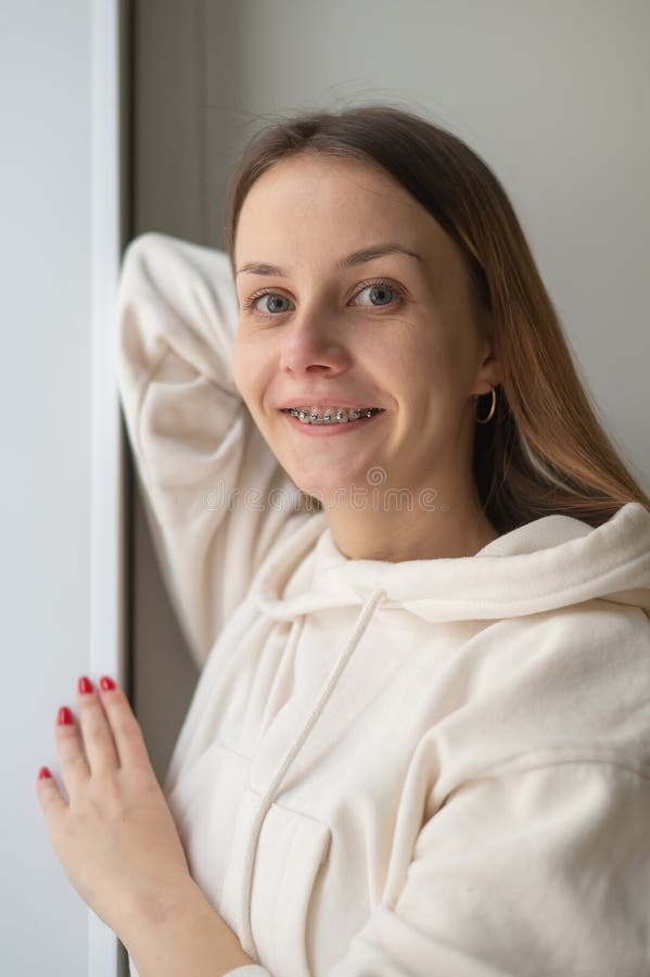 Woman Smiling with Braces on Her Teeth. Stock Photo - Image of bracket ...
