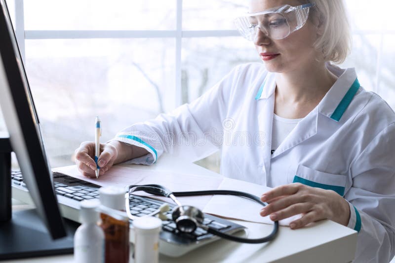 Woman Smiling Doctor Working on the Computer Stock Image - Image of ...