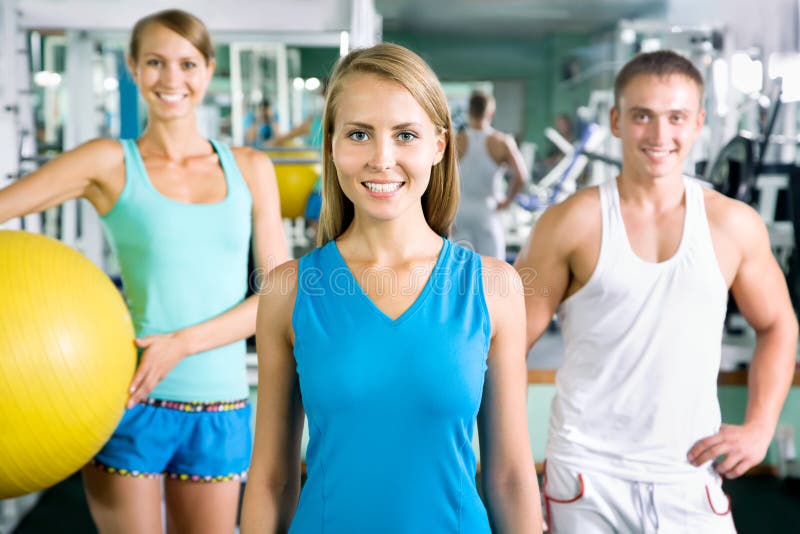 Woman Smiling in Front of a Group of Gym People Stock Photo - Image of ...