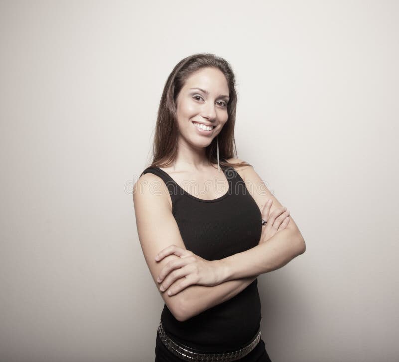 Woman Smiling with Her Arms Crossed Stock Image - Image of space, white ...
