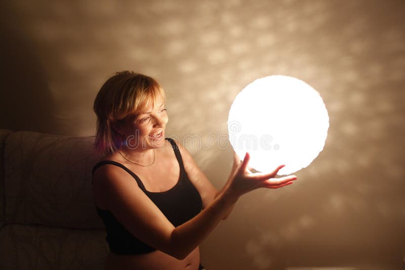Woman Smiling with a Light Ball Stock Image - Image of happiness, smile ...