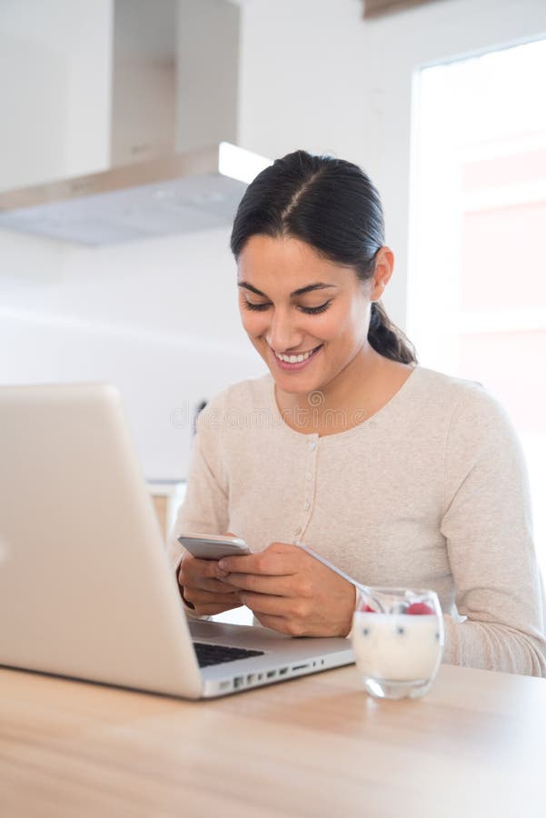 Woman Texting and Smiling on a Cell Phone Stock Image - Image of meal ...