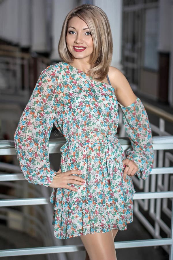 Woman Smiling at the Mall, Dressed in a Dress Stock Photo - Image of ...