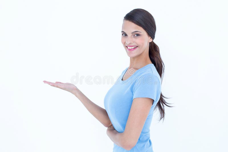Woman Smiling Presenting Something with Her Hand Stock Image - Image of ...