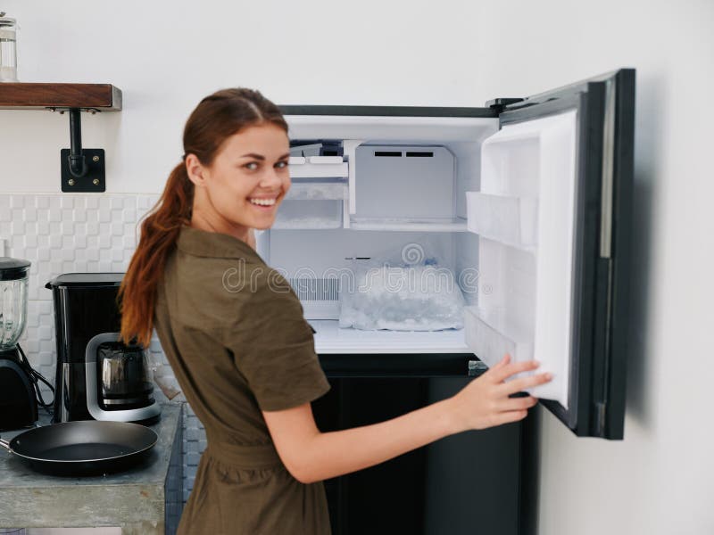 Woman Smiling with Teeth Looking into Camera in Kitchen at Home Opened ...