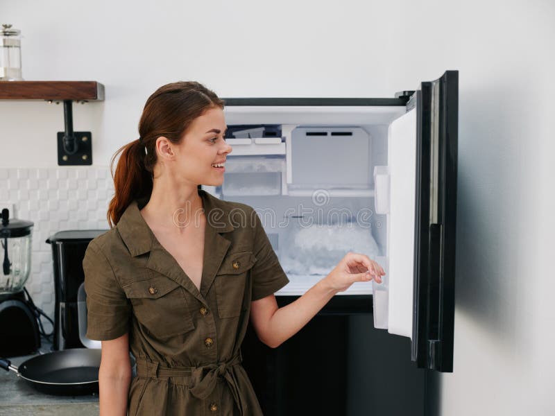 Woman Smiling with Teeth Looking into Camera in Kitchen at Home Opened ...