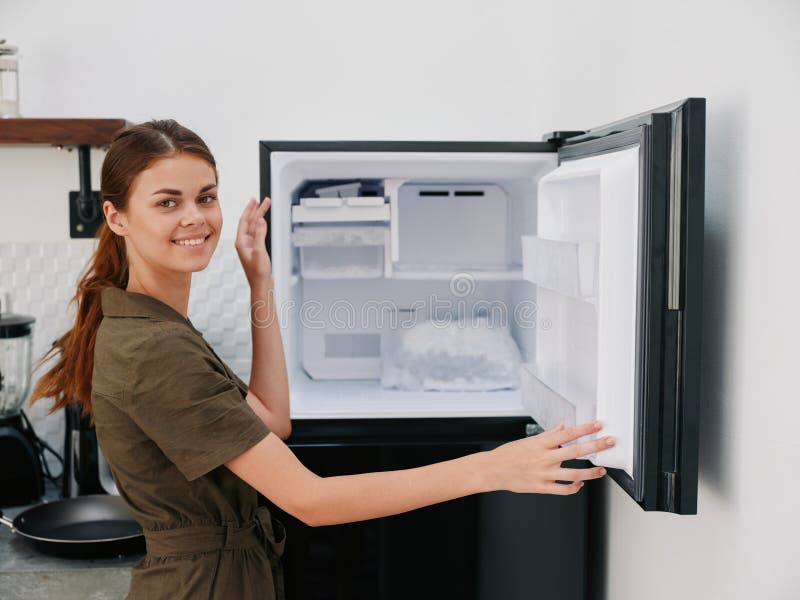 Woman Smiling with Teeth Looking into Camera in Kitchen at Home Opened ...