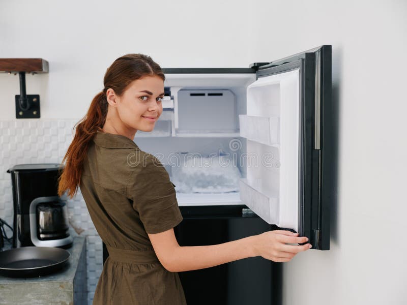 Woman Smiling with Teeth Looking into Camera in Kitchen at Home Opened ...