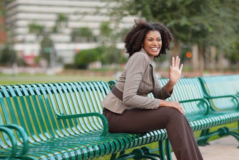 Woman smiling and waving stock image. Image of american - 18305743