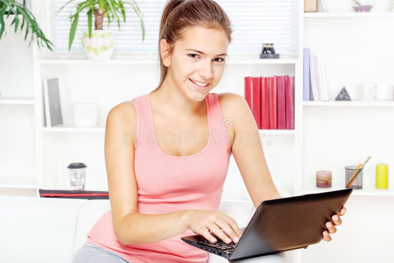 Woman Smiling while Working on Tablet Computer Stock Image - Image of ...