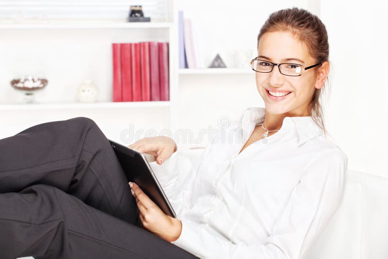 Woman Smiling while Working on Tablet Computer Stock Image - Image of ...