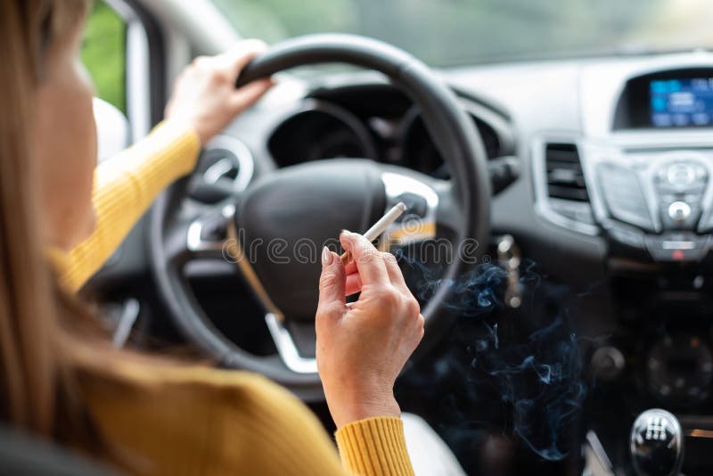 Smoking while driving stock photo. Image of lifestyle - 201350286