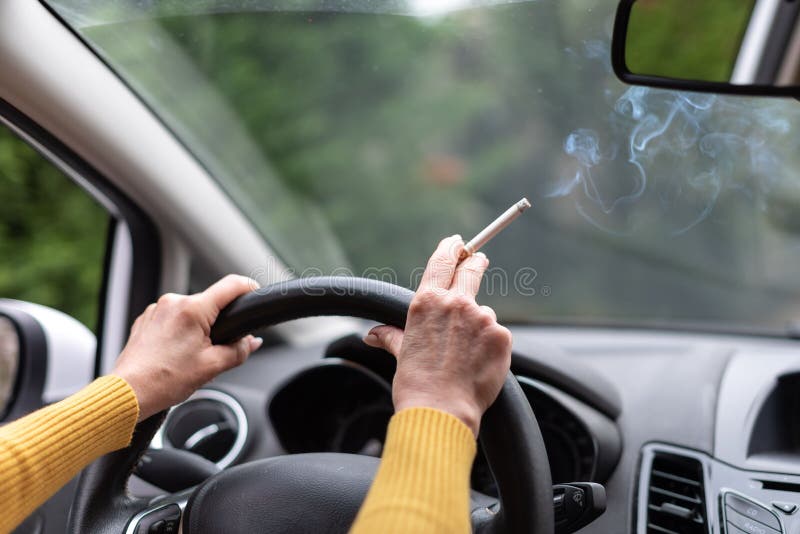 Smoking while driving stock photo. Image of transport - 206450188