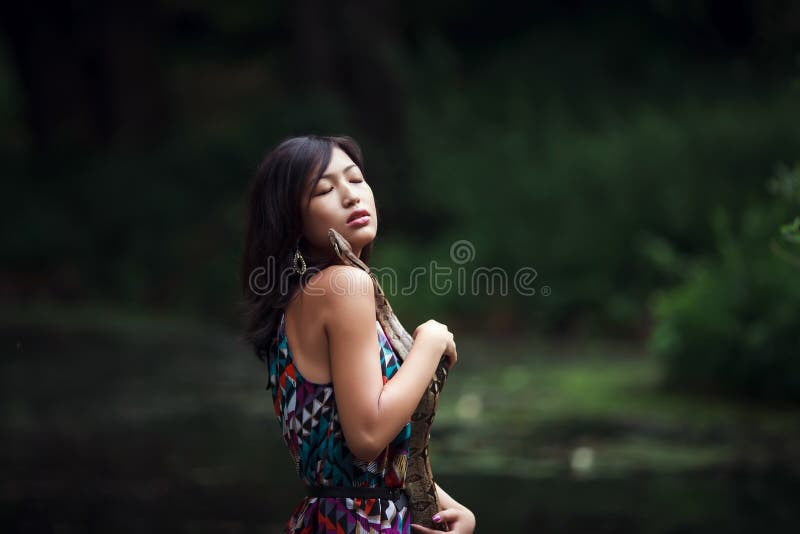 Woman with snake stock image. Image of long, outdoor - 48403269
