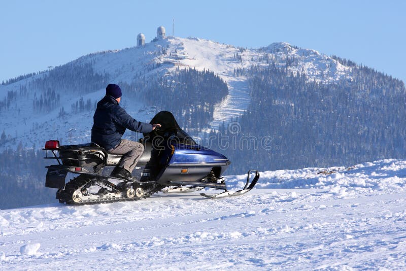 Woman on snowmobile stock image. Image of rock, sanctuary - 10249089