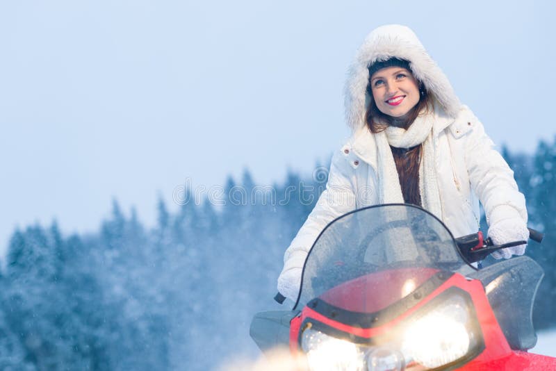 Woman and snowmobile stock photo. Image of attractive - 29609322