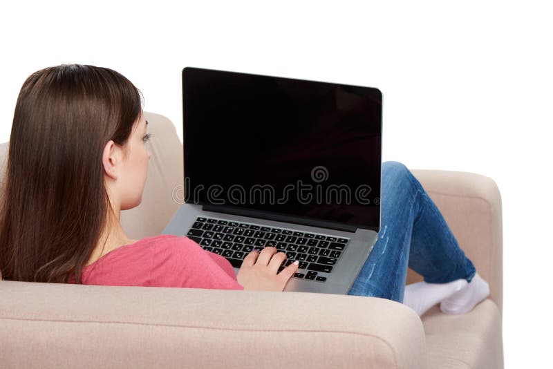 Woman on sofa using laptop stock image. Image of freelance - 54065547