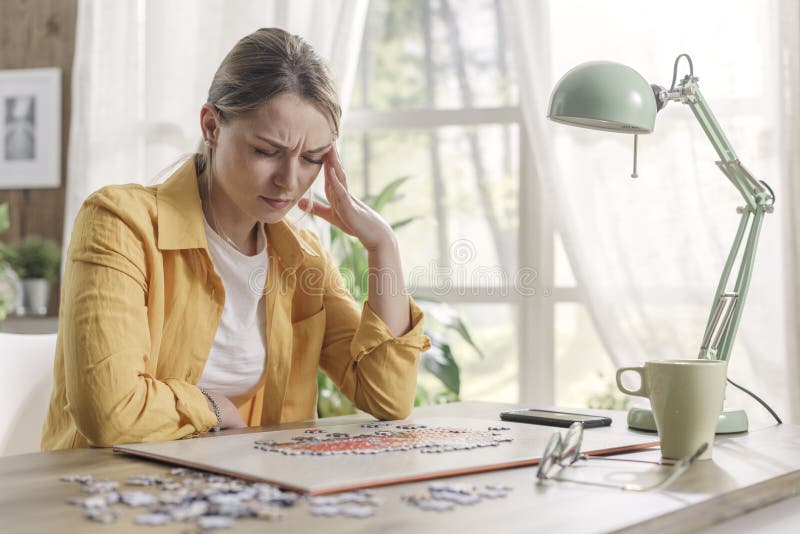 Woman Solving a Puzzle and Having a Headache Stock Image - Image of ...
