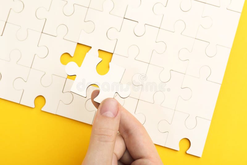 Woman Solving White Puzzle Yellow Background Closeup Stock Photos ...