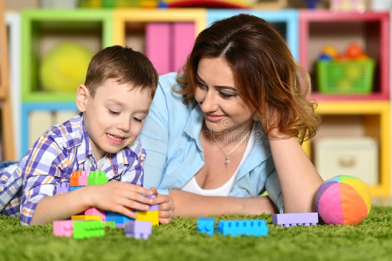 Woman and Son Playing with Plastic Blocks on Floor Stock Image - Image ...