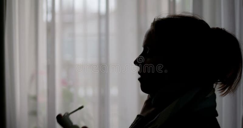 A Man With A Sore Throat Sprays A Medicinal Aerosol Spray Down His