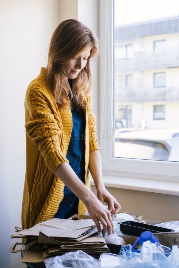 Woman Sorting Different Type of Garbage in Her Kitchen. Stock Photo ...