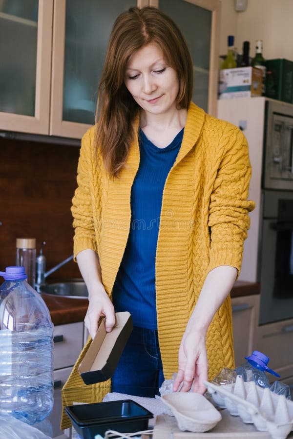 Woman Sorting Different Type of Garbage in Her Kitchen. Stock Image ...