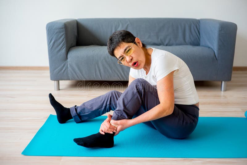 Woman sprained her leg stock image. Image of concept - 97496257